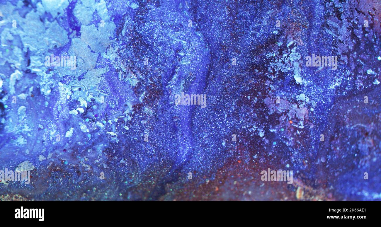 glitter fluid texture paint mix blue particles Stock Photo - Alamy