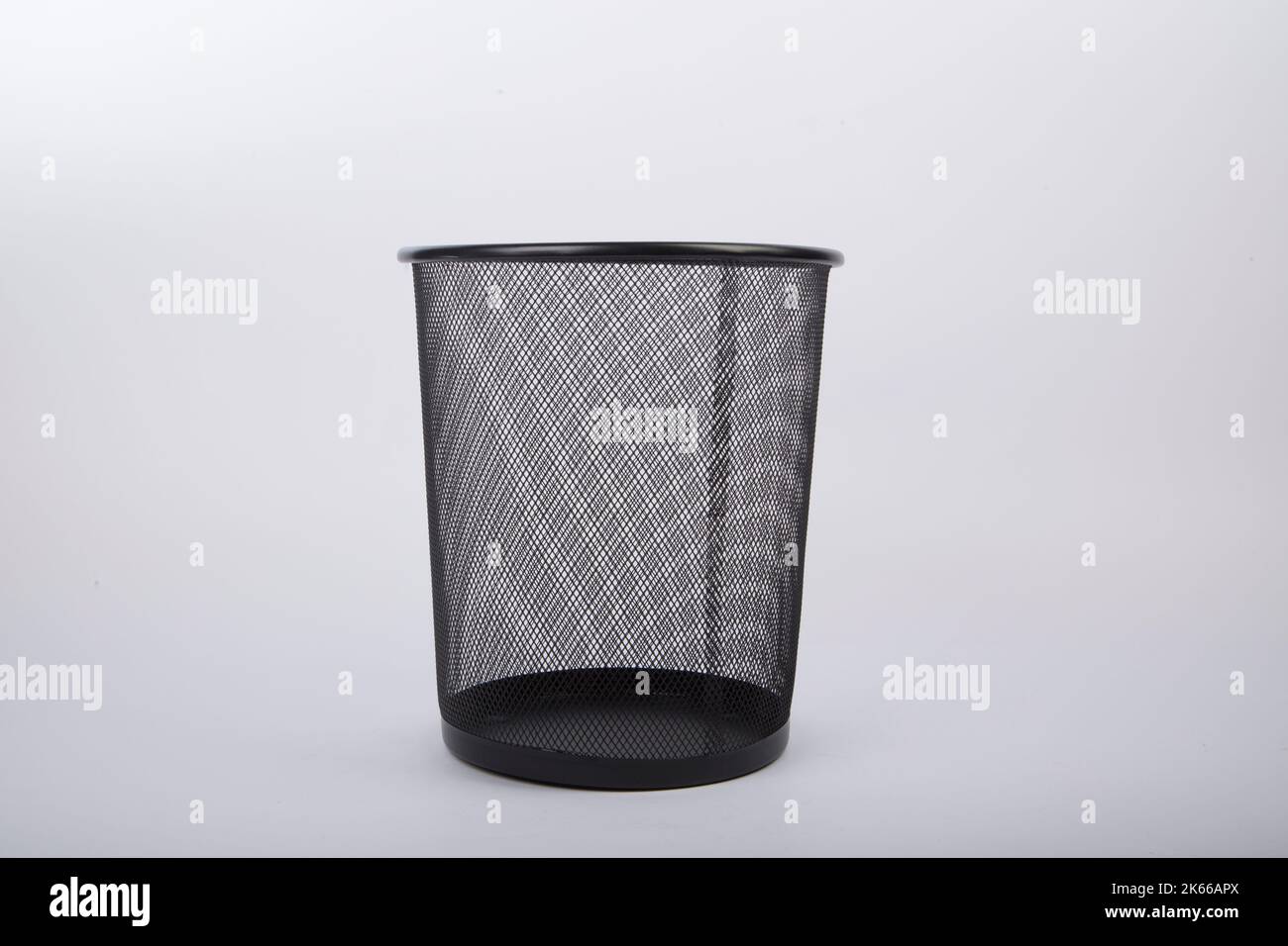 A garbage can isolated on a gray background Stock Photo - Alamy