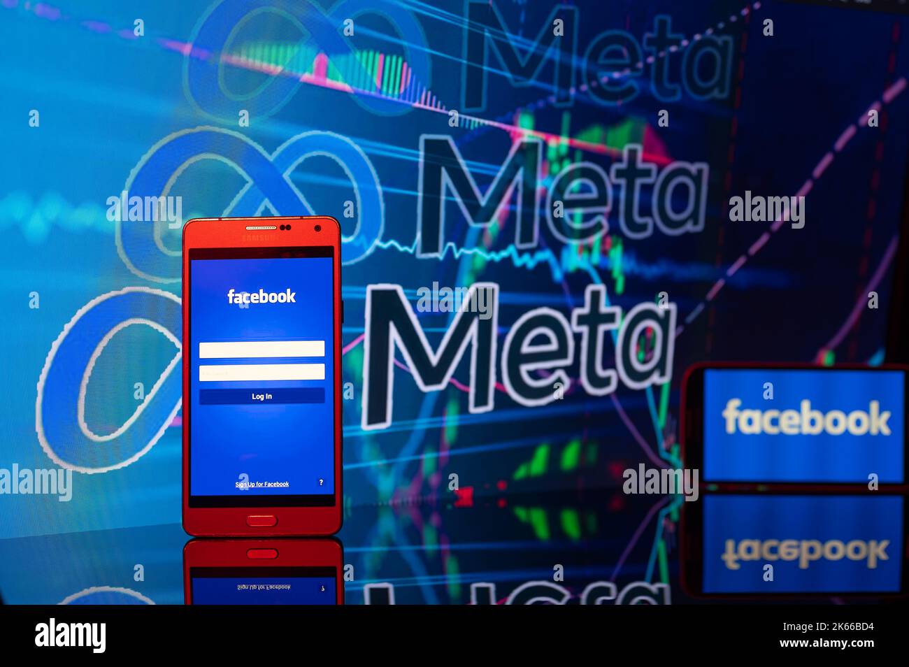 The smartphones with Facebook login screen and Meta logo in the ...