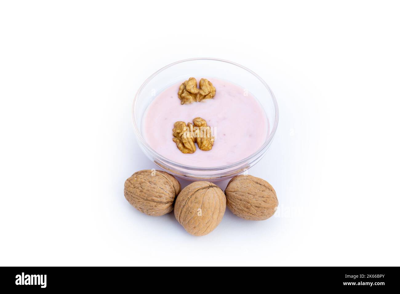 Walnuts in a bowl of strawberry yoghurt, healthy breakfast, isolated on ...