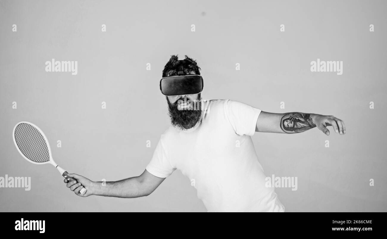 Virtual sport concept. Man with beard in VR glasses beating pitch, grey ...