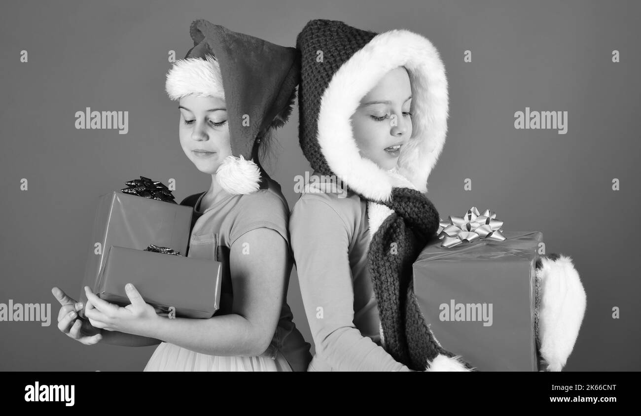 Children with excited faces stand back to back Stock Photo - Alamy