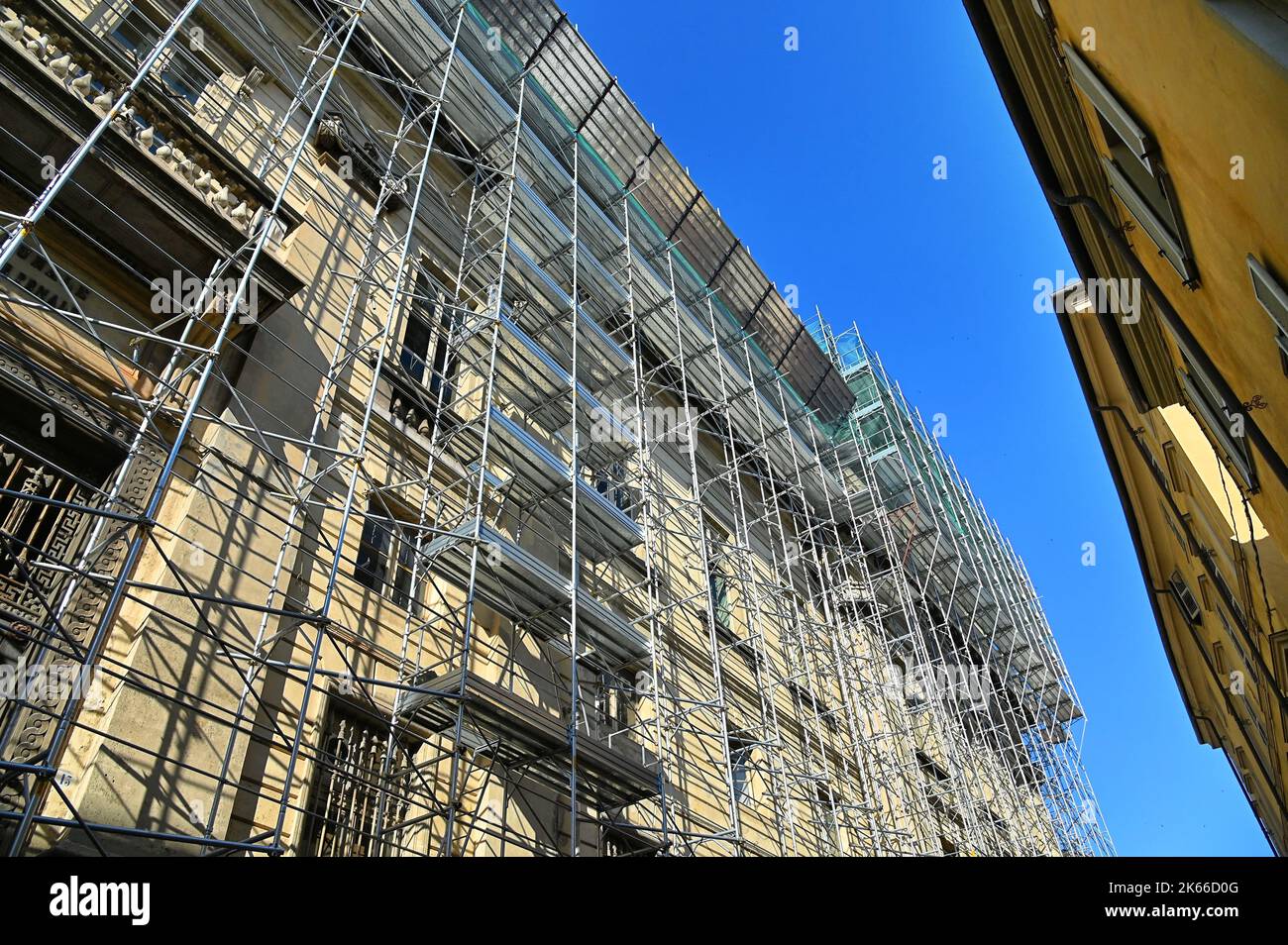 A low angle view ofa scaffolding surrounding an ancient building for ...