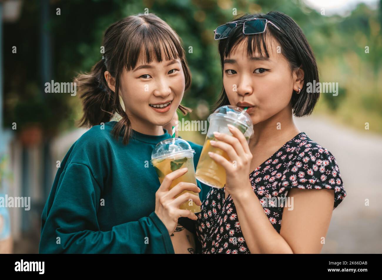 Asian girl drinking lemonade hi-res stock photography and images - Alamy