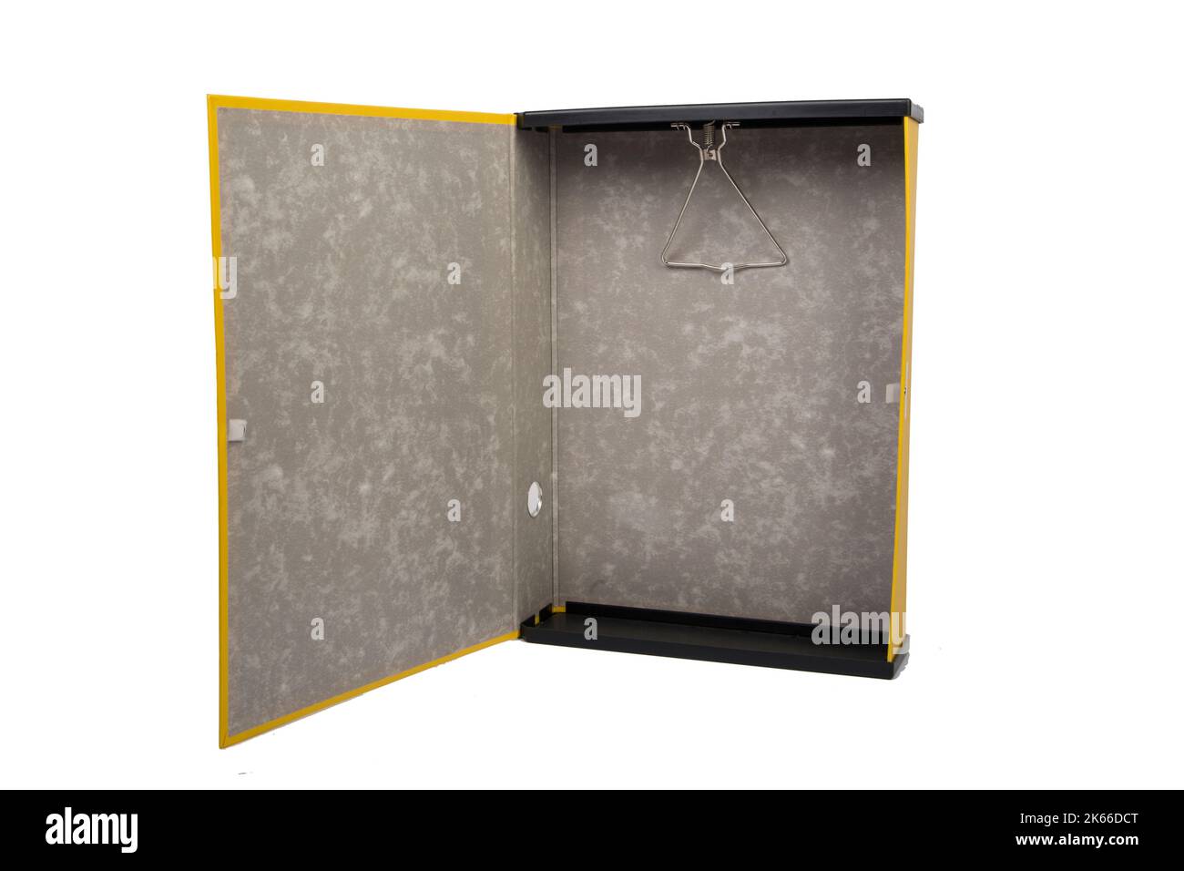 A yellow clip box file for holding documents isolated on white ...