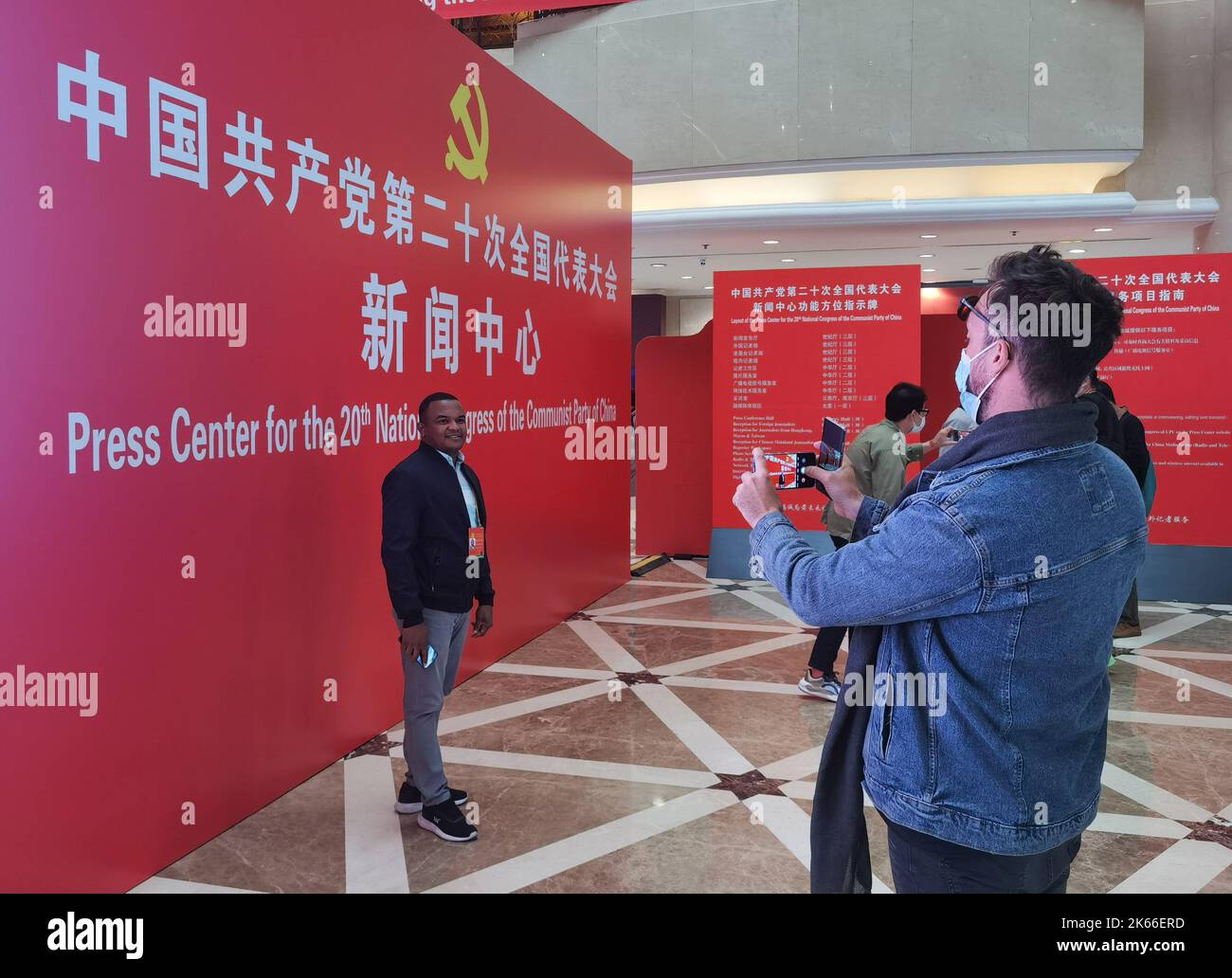 Beijing, China. 12th Oct, 2022. A journalist poses for a photo at the ...