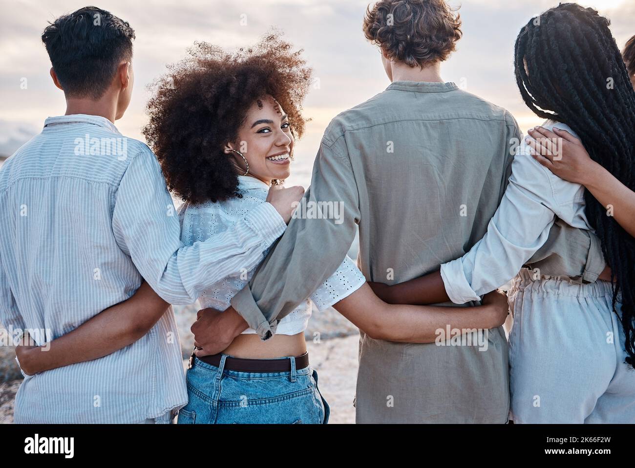 Rear view of a Unknown group of friends enjoying their time together at ...