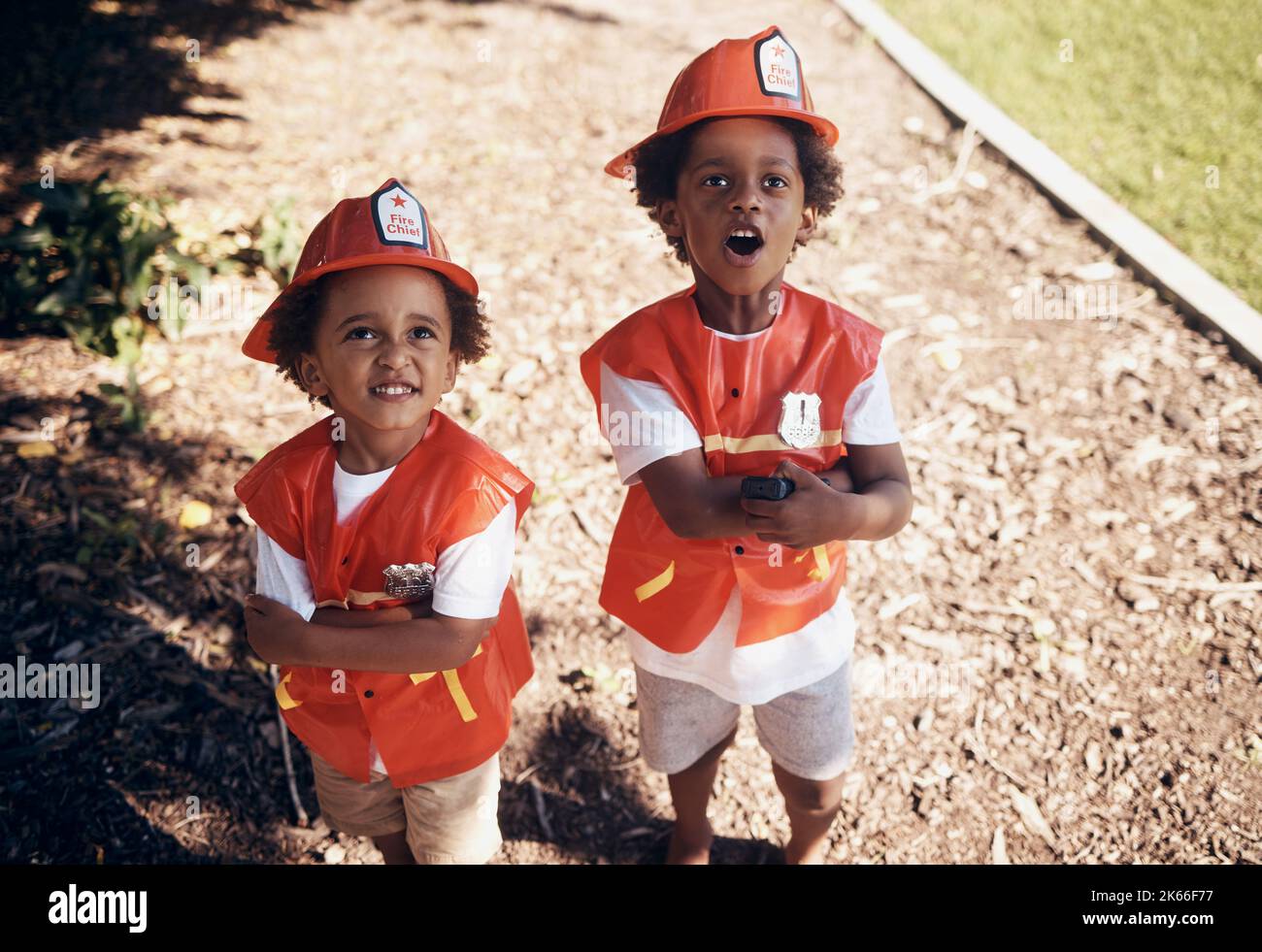 Two cute little african american boys having fun while playing outside ...