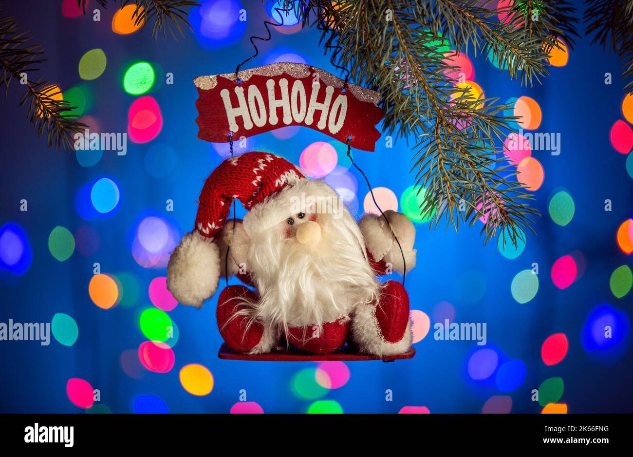 Jolly santa claus toy on sparkling and fabulous bokeh background with ...