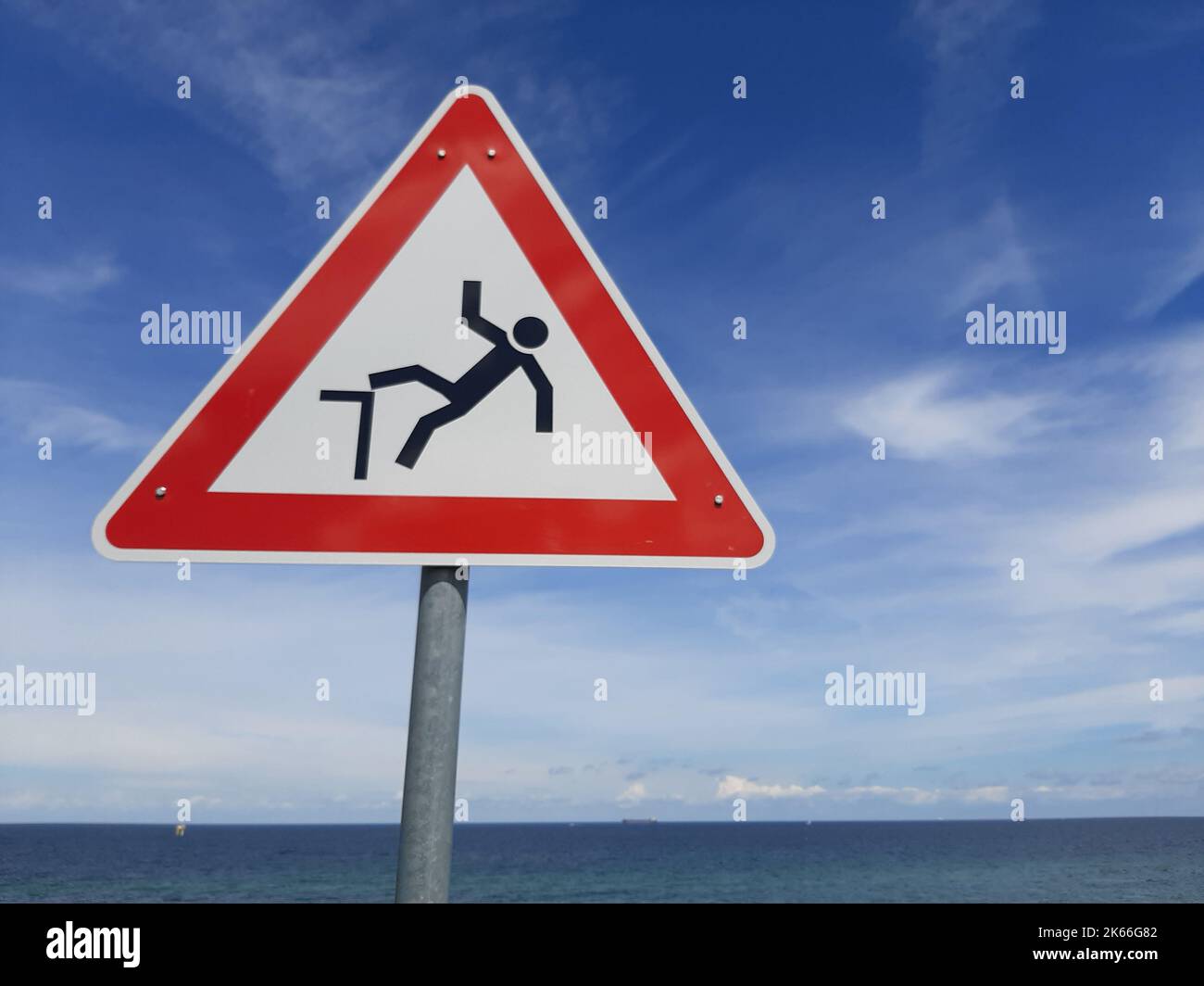 Pictogram sign: risk of falling at the cliff of the Baltic Sea, Germany ...