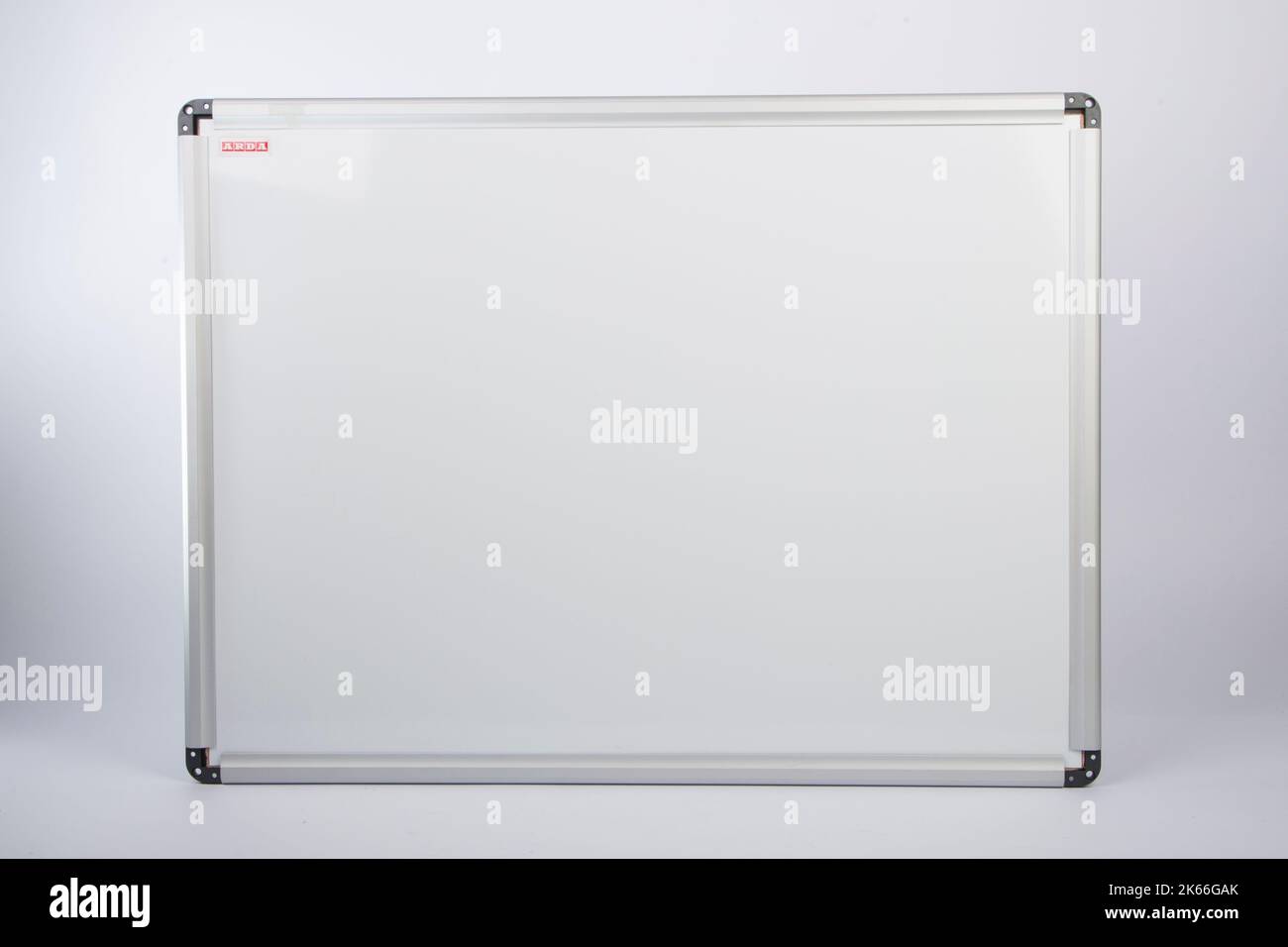 A rectangle whiteboard with a marker isolated on a gray background ...