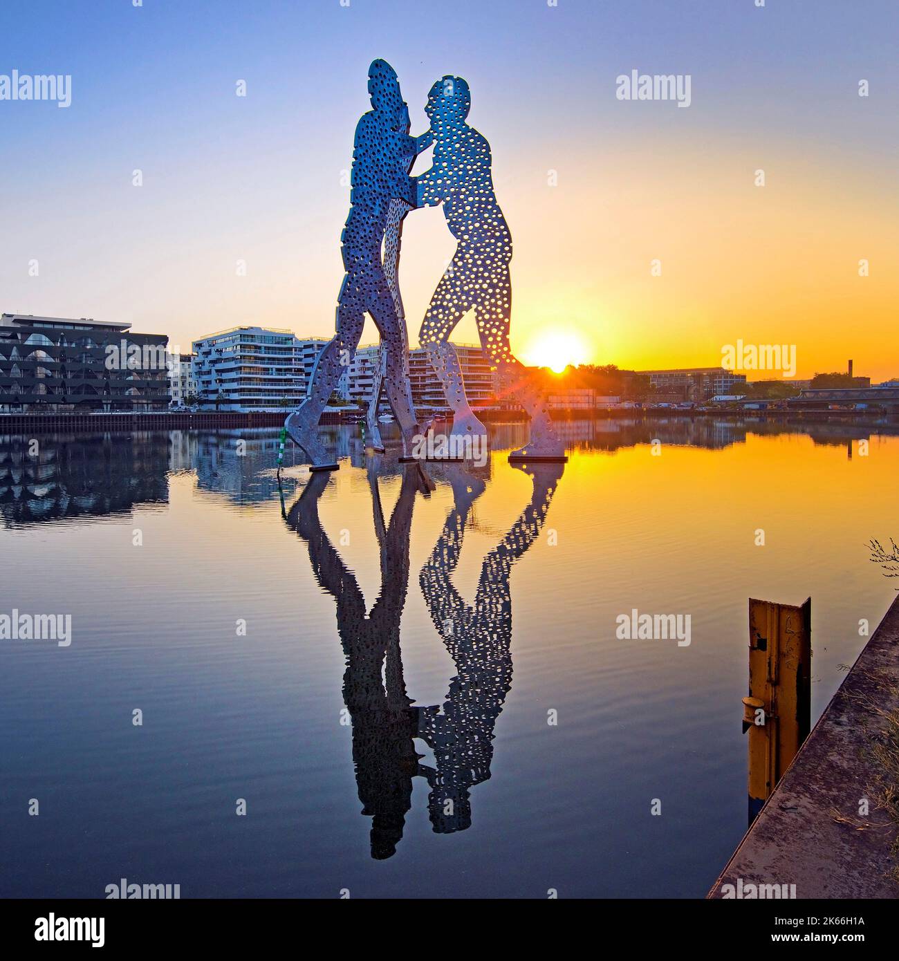 Molecule Man, monumental work of art in the Spree at sunrise, Germany ...