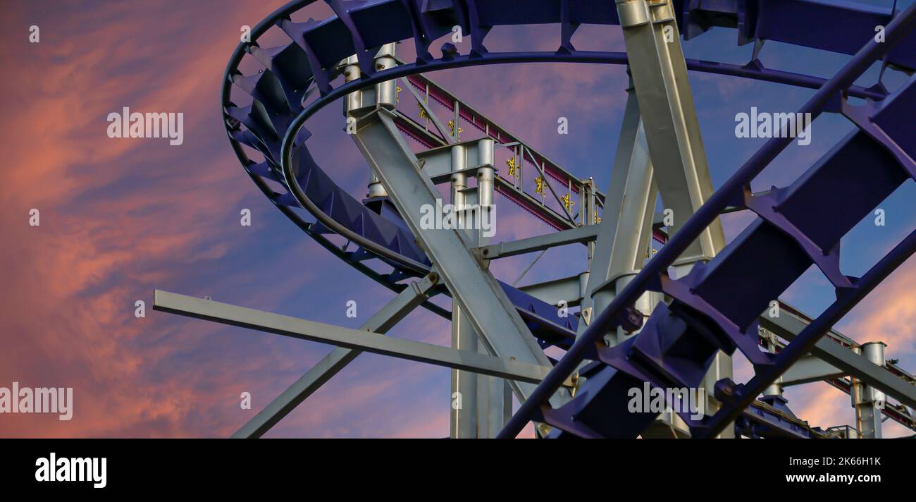 Attraction roller-coaster (switchback) against the background of a ...