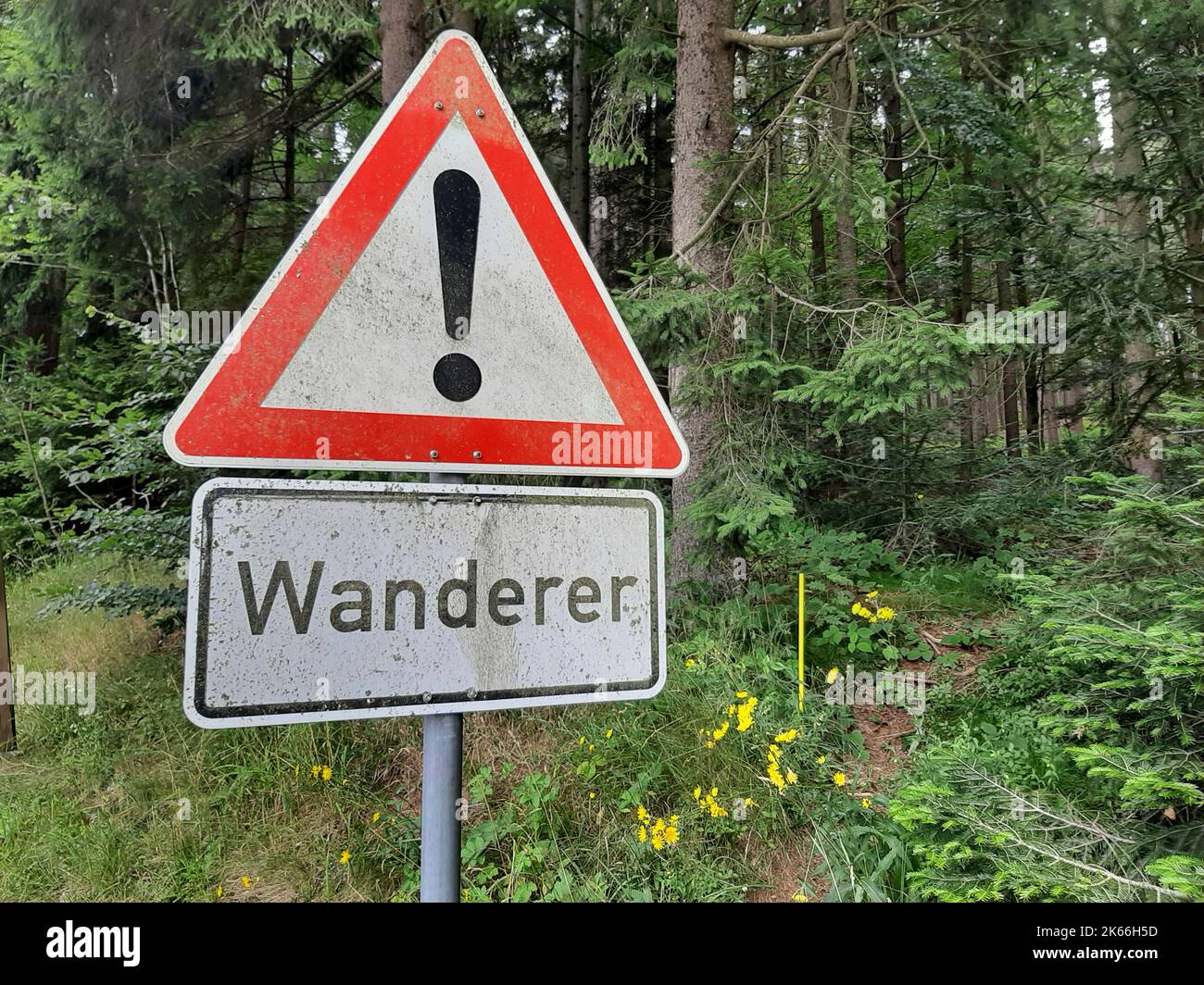 Road sign 'Caution hikers' on a road, Germany Stock Photo - Alamy