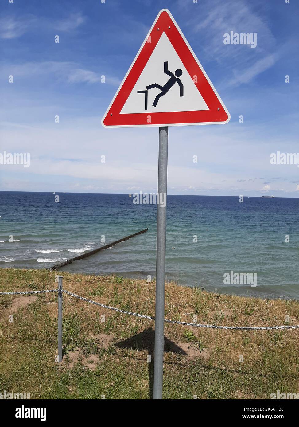 Pictogram sign: risk of falling at the cliff of the Baltic Sea, Germany ...