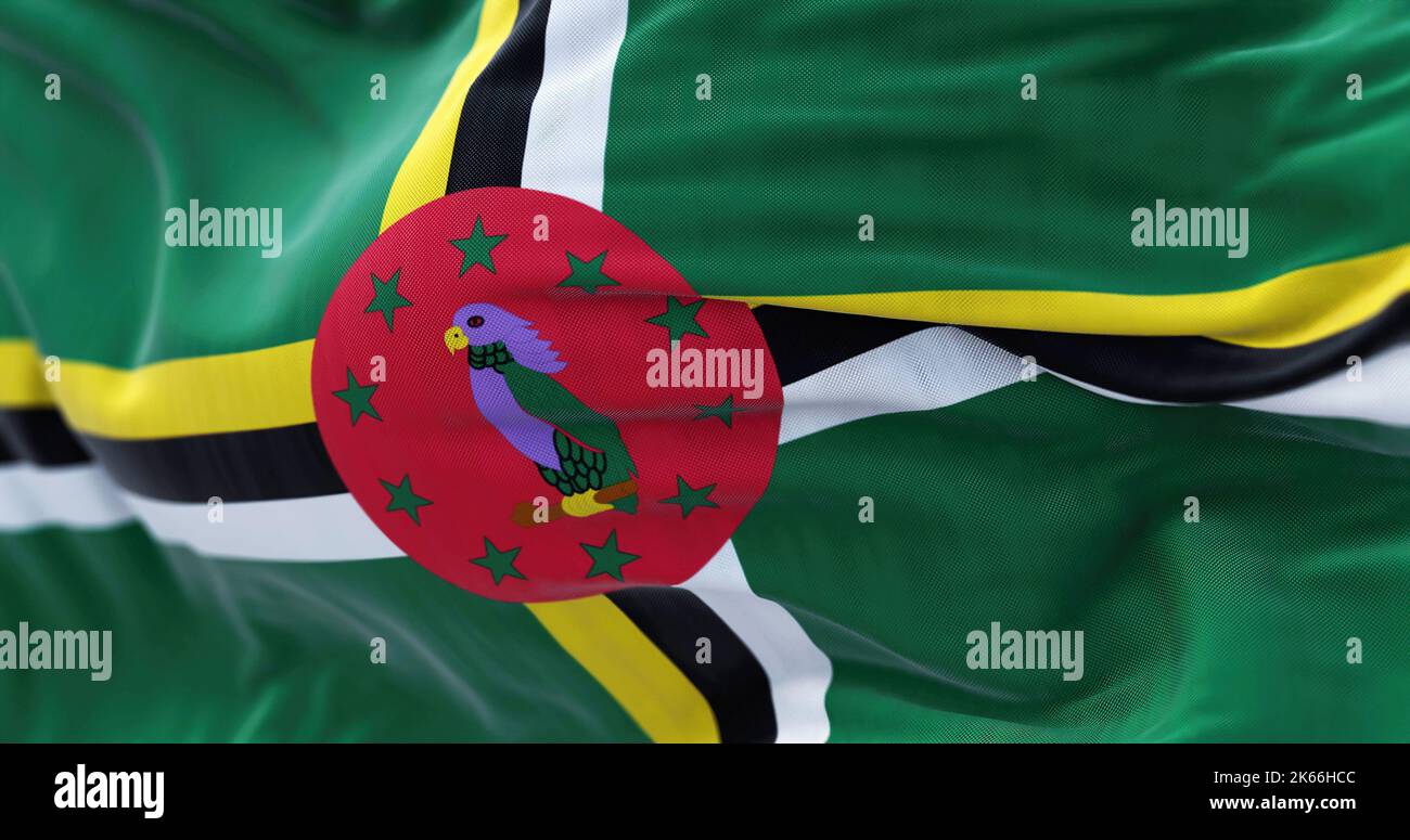 Close-up view of the Dominica national flag waving in the wind. The ...
