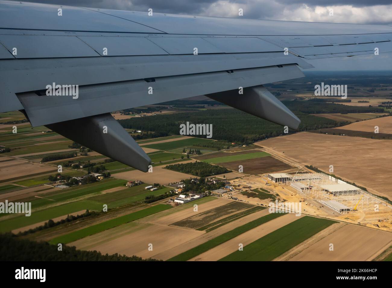 View from the plane window to the wing. Photo taken while flying above ...