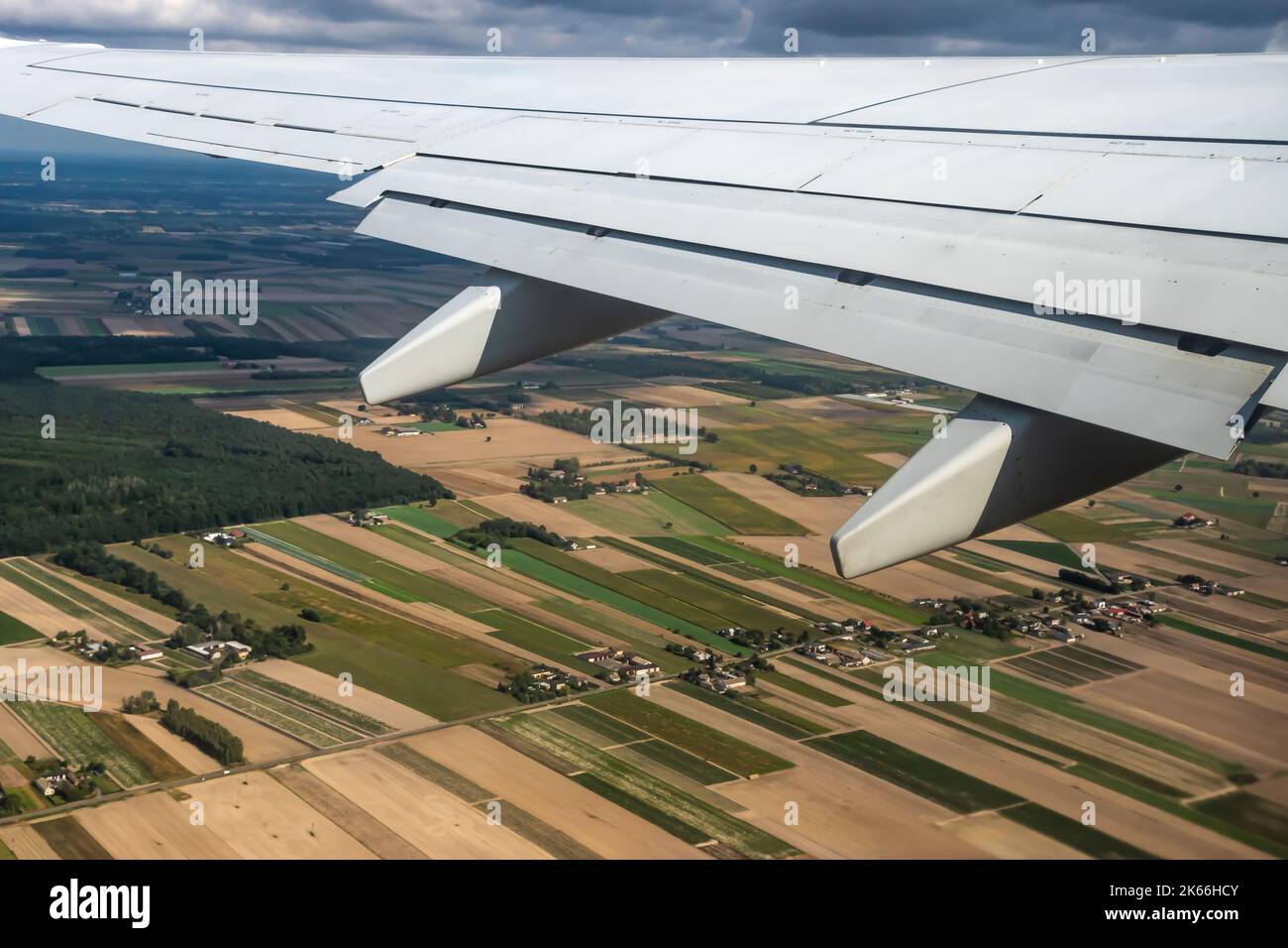 View from the plane window to the wing. Photo taken while flying above ...