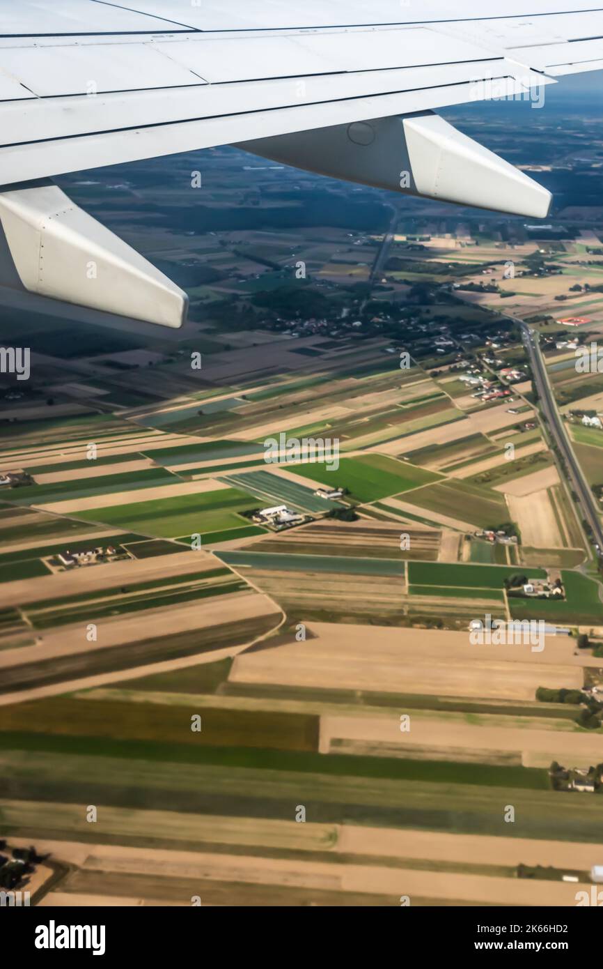 View from the plane window to the wing. Photo taken while flying above ...