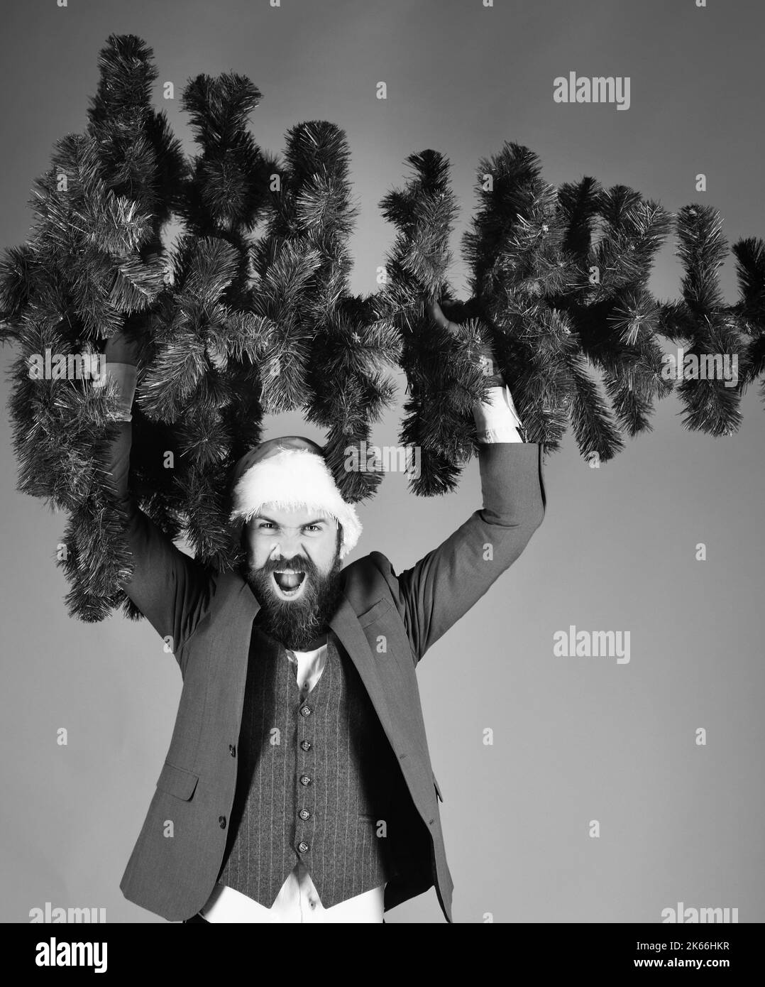 Man carry xmas tree Black and White Stock Photos & Images - Alamy