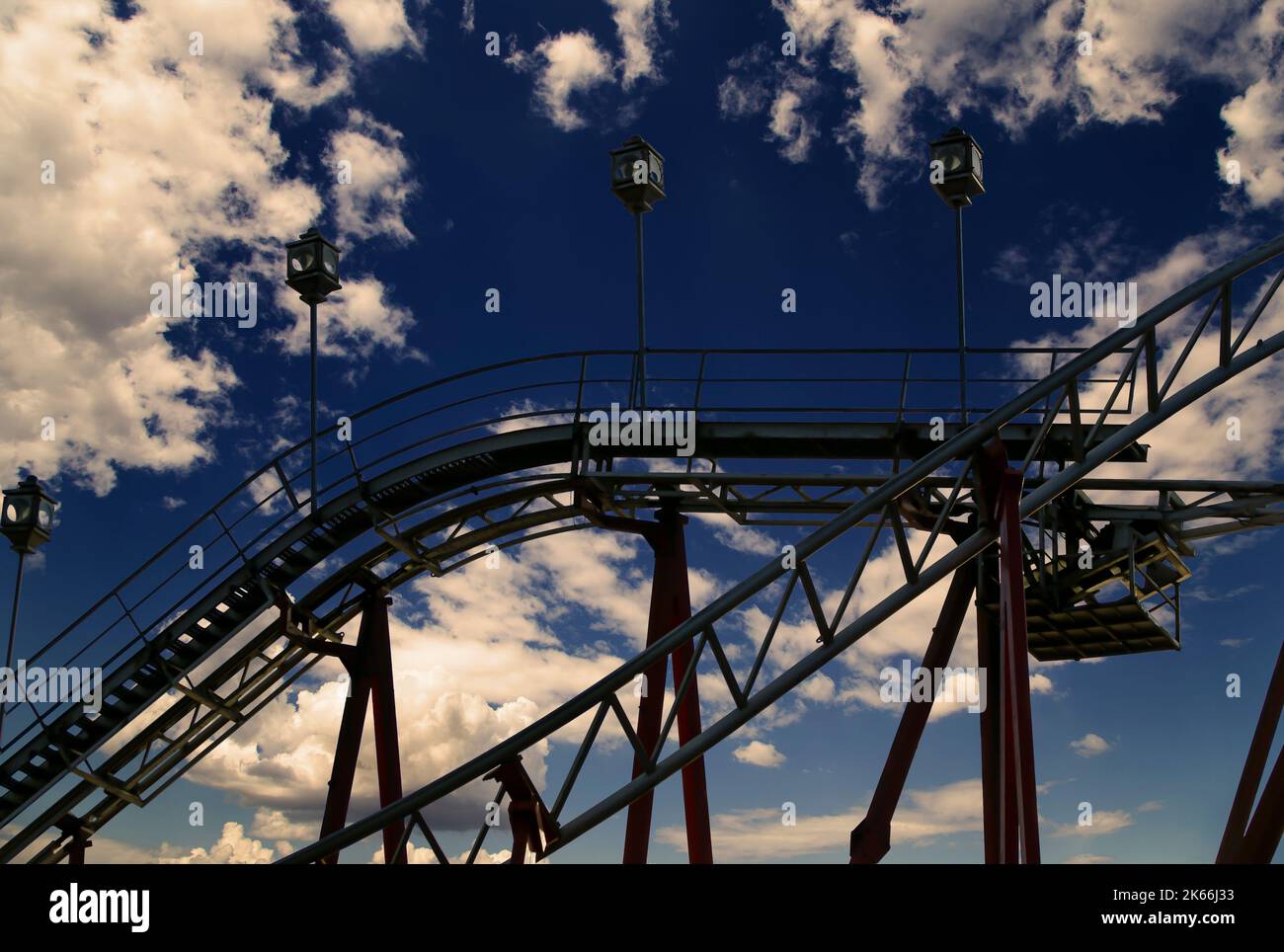 Attraction roller-coaster (switchback) against the background of a ...
