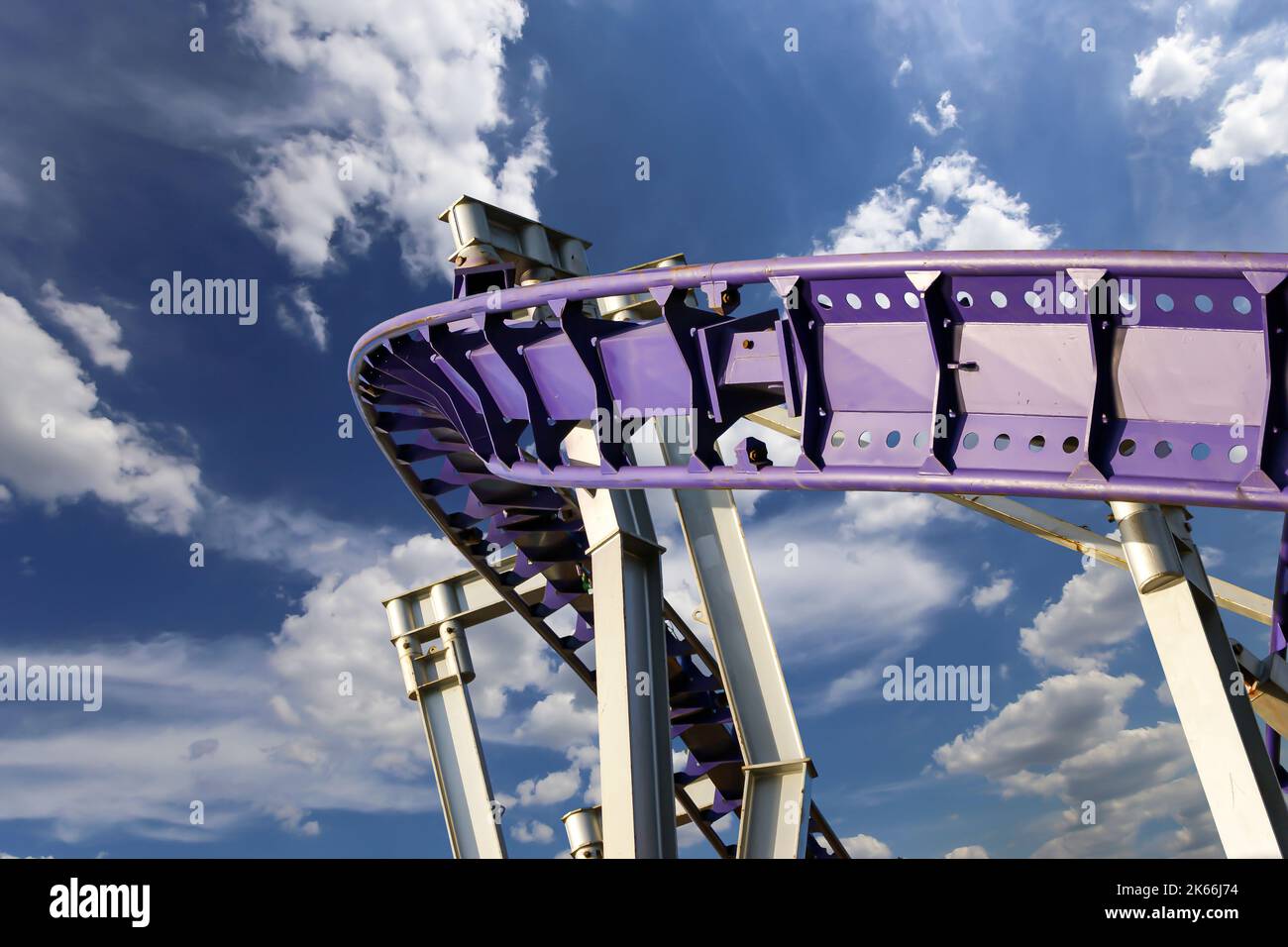 Attraction roller-coaster (switchback) on the background of the cloudy ...