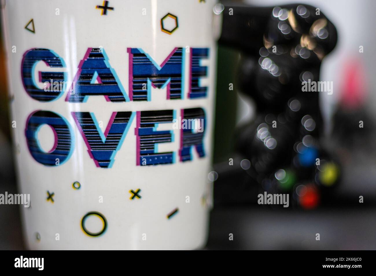 Mug with the message Game OVER. Gamer concept Stock Photo - Alamy