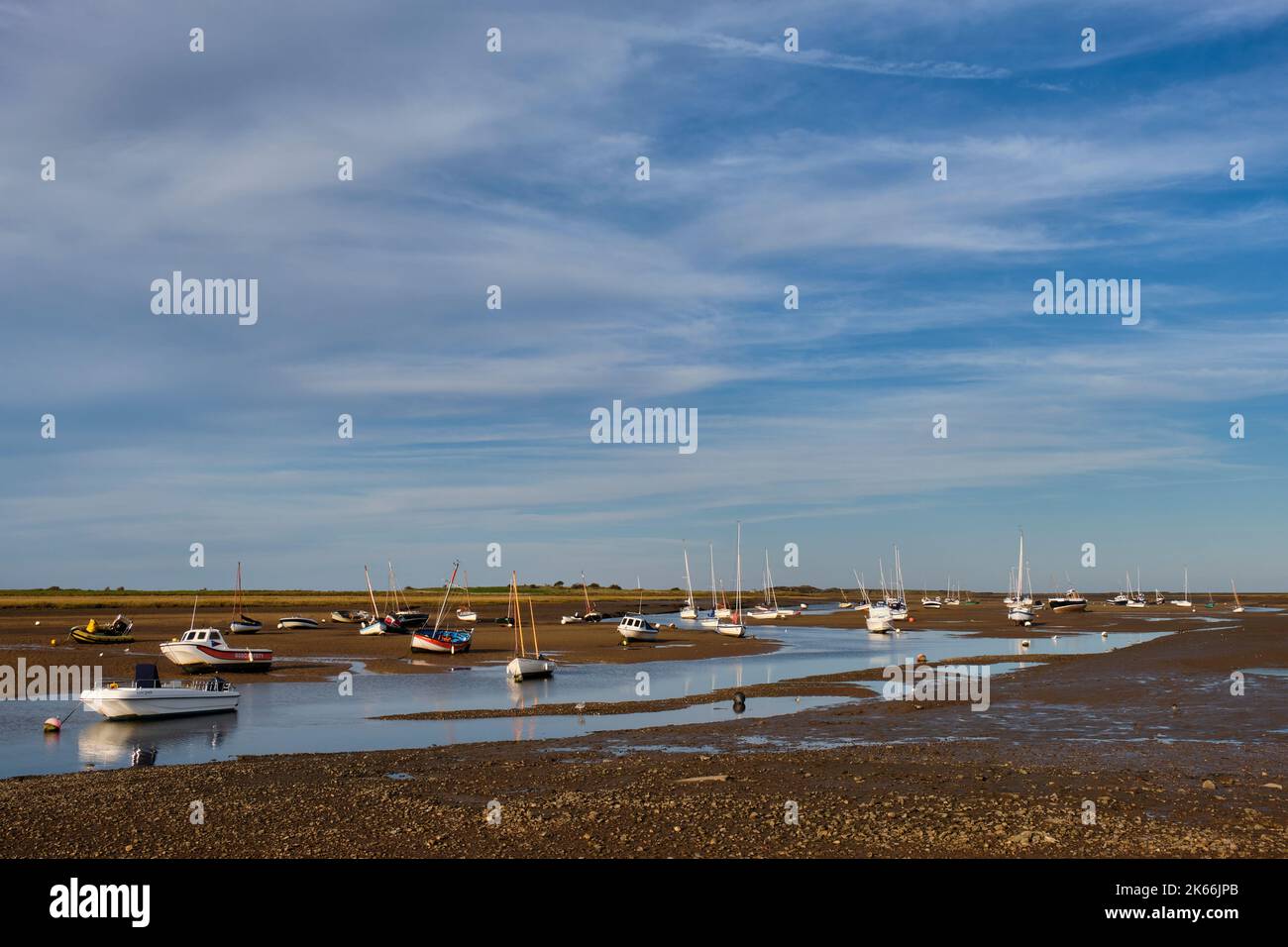 Boats at low tide at Brancaster Staithe, Norfolk Stock Photo - Alamy