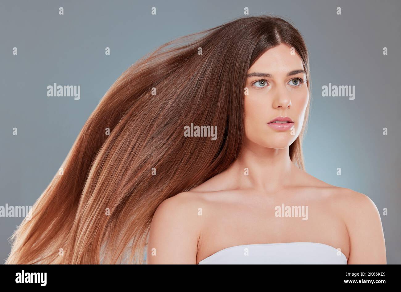 Hair is the fastest growing tissue in the human body. Studio shot of a ...
