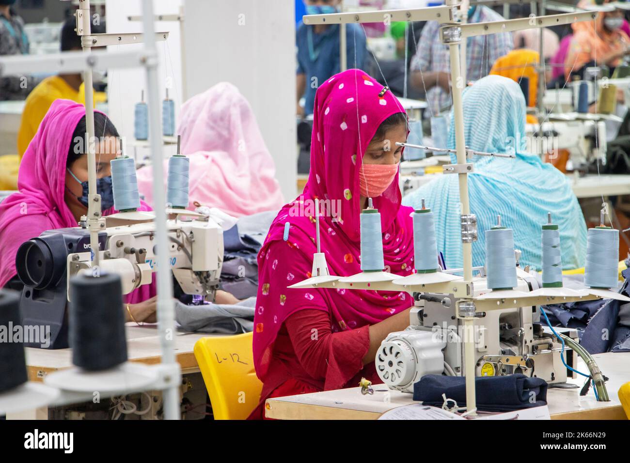 Gazipur, Dhaka, Bangladesh. 12th Oct, 2022. Workers make clothes at a ...