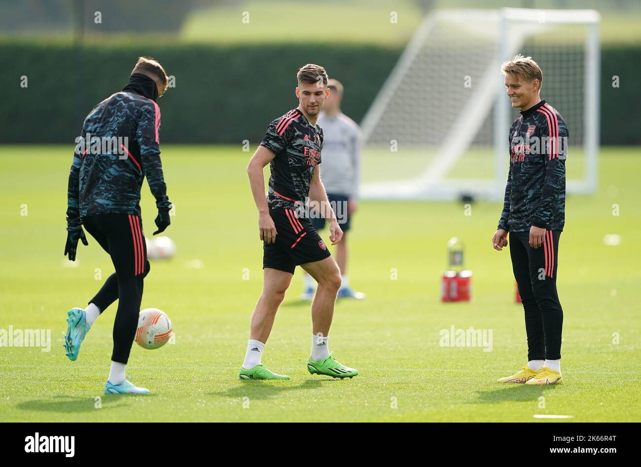 Arsenal's Martin Odegaard (right) and Kieran Tierney (centre) during a ...