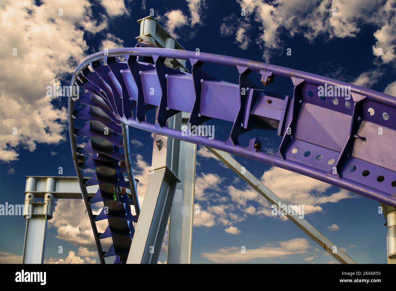 Attraction roller-coaster (switchback) against the background of a ...