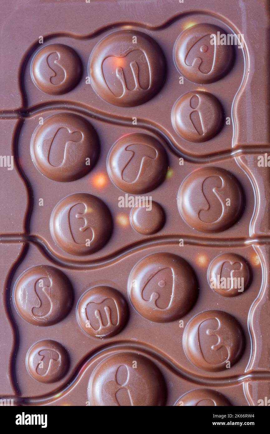 Bar of Nestle Smarties chocolate bar close up - milk chocolate with ... Bar of Nestle Smarties chocolate bar close up - milk chocolate with ...