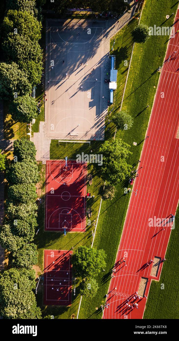 A top view of several playing fields and a running track surrounded by ...