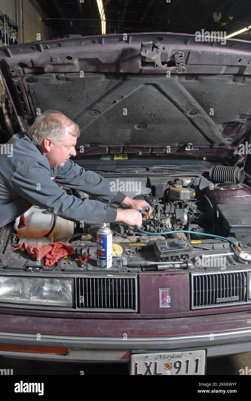 Mechanics servicing car engine hi-res stock photography and images - Alamy