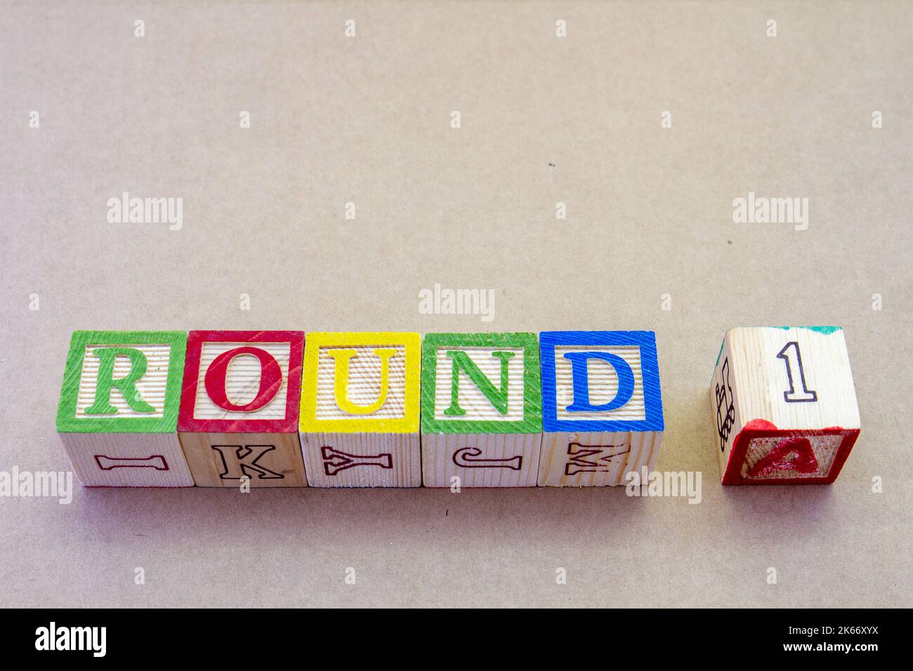 The term round 1 displayed visually on a clear background with copy ...