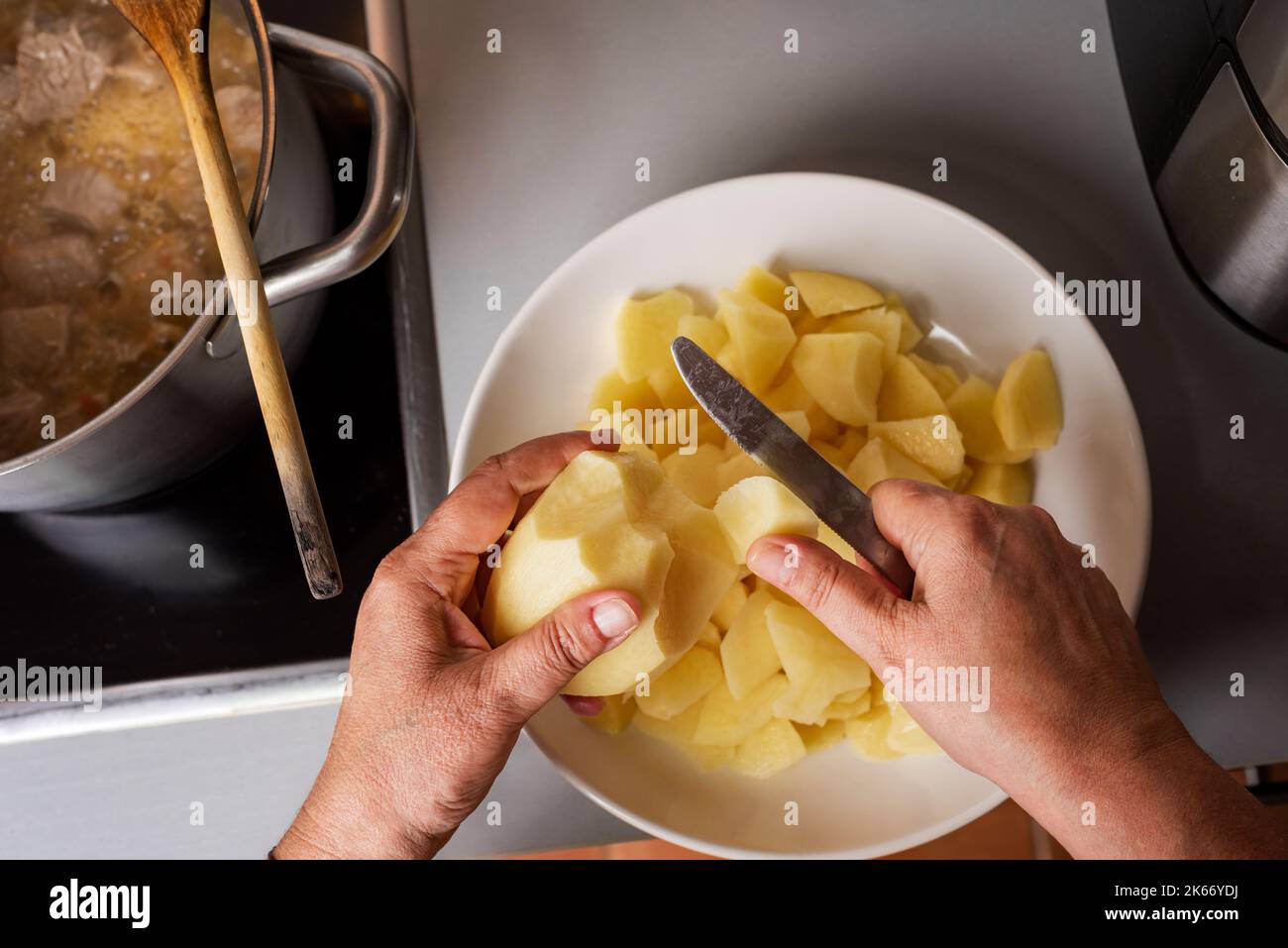 Potato goulash hands hi-res stock photography and images - Alamy