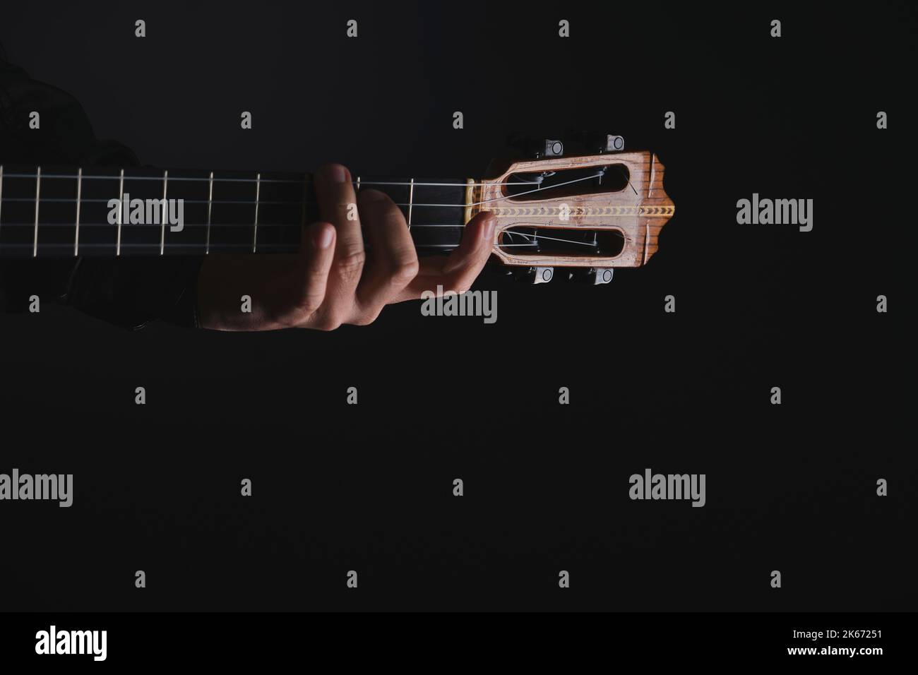 Another chords. String Cuatro instrument recording session, closeup ...