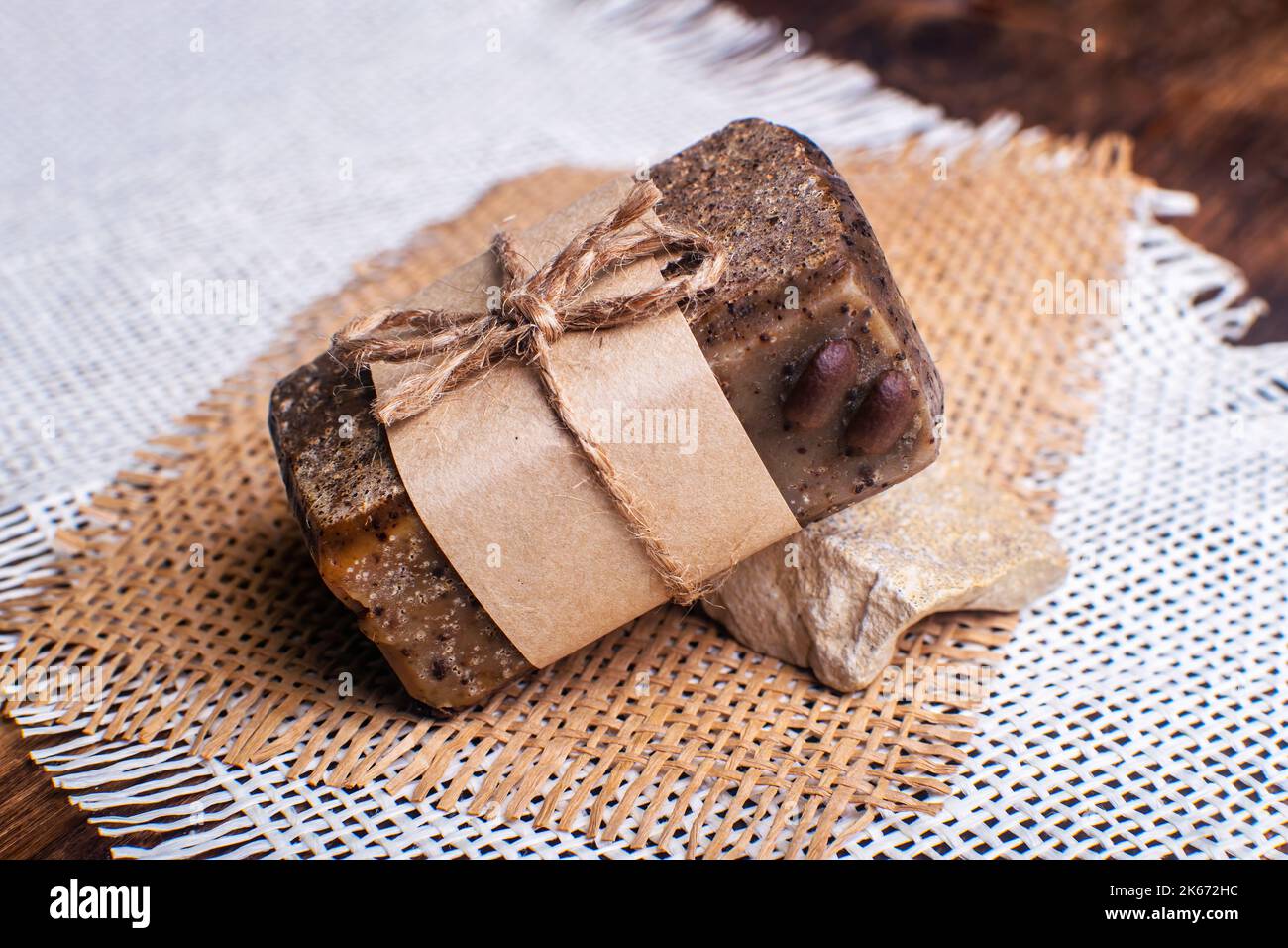 Piece of handmade organic soap with coffee beans. Spa concept for ...