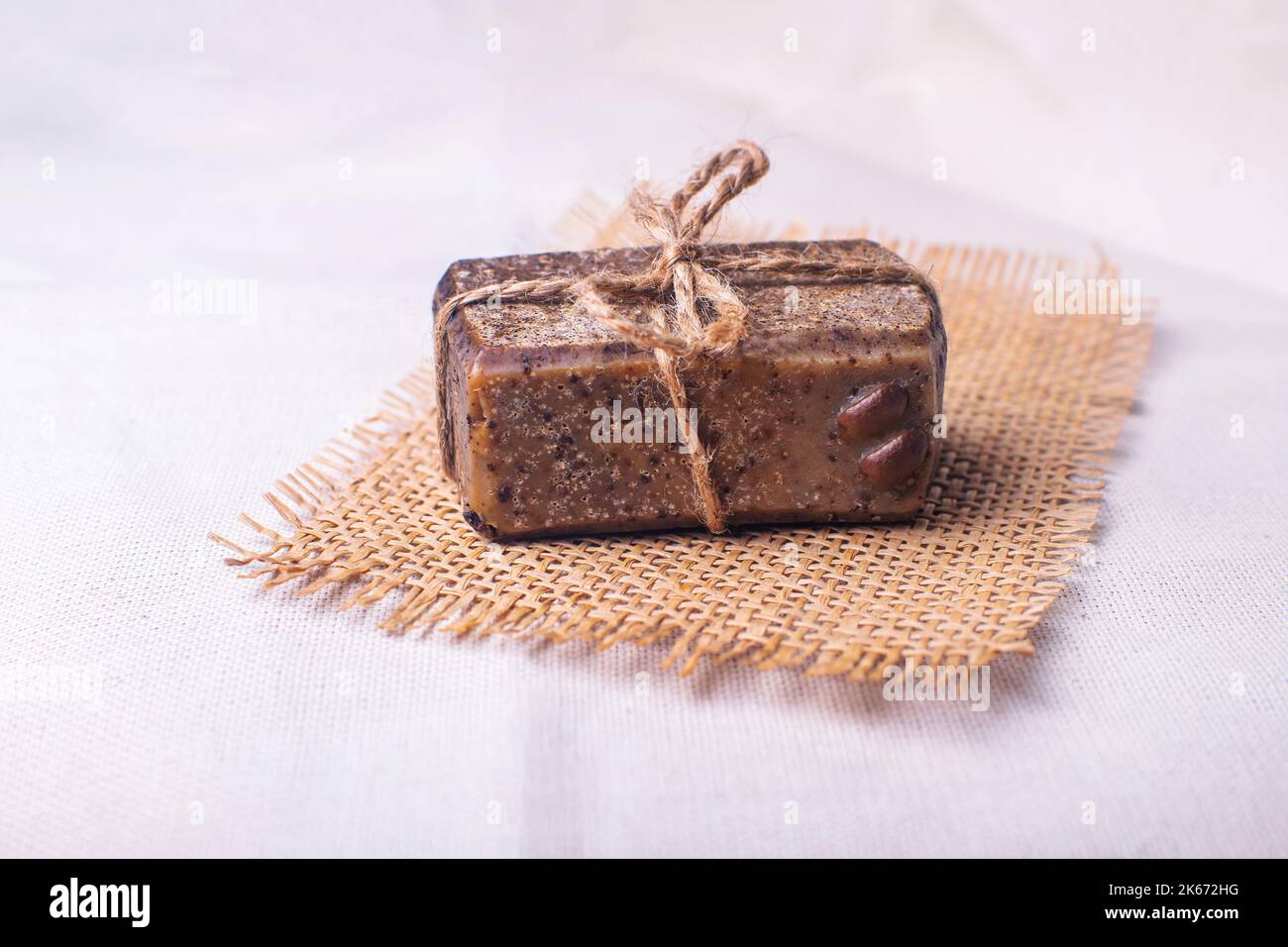 Piece of handmade organic soap with coffee beans. Spa concept for ...