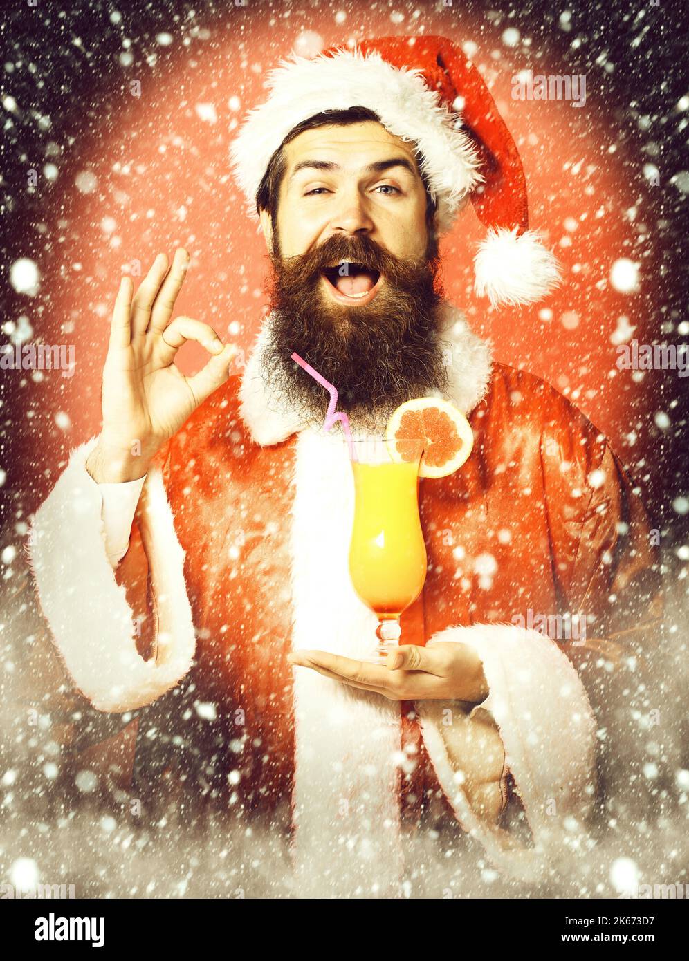 handsome bearded santa claus man with long beard on funny face holding ...