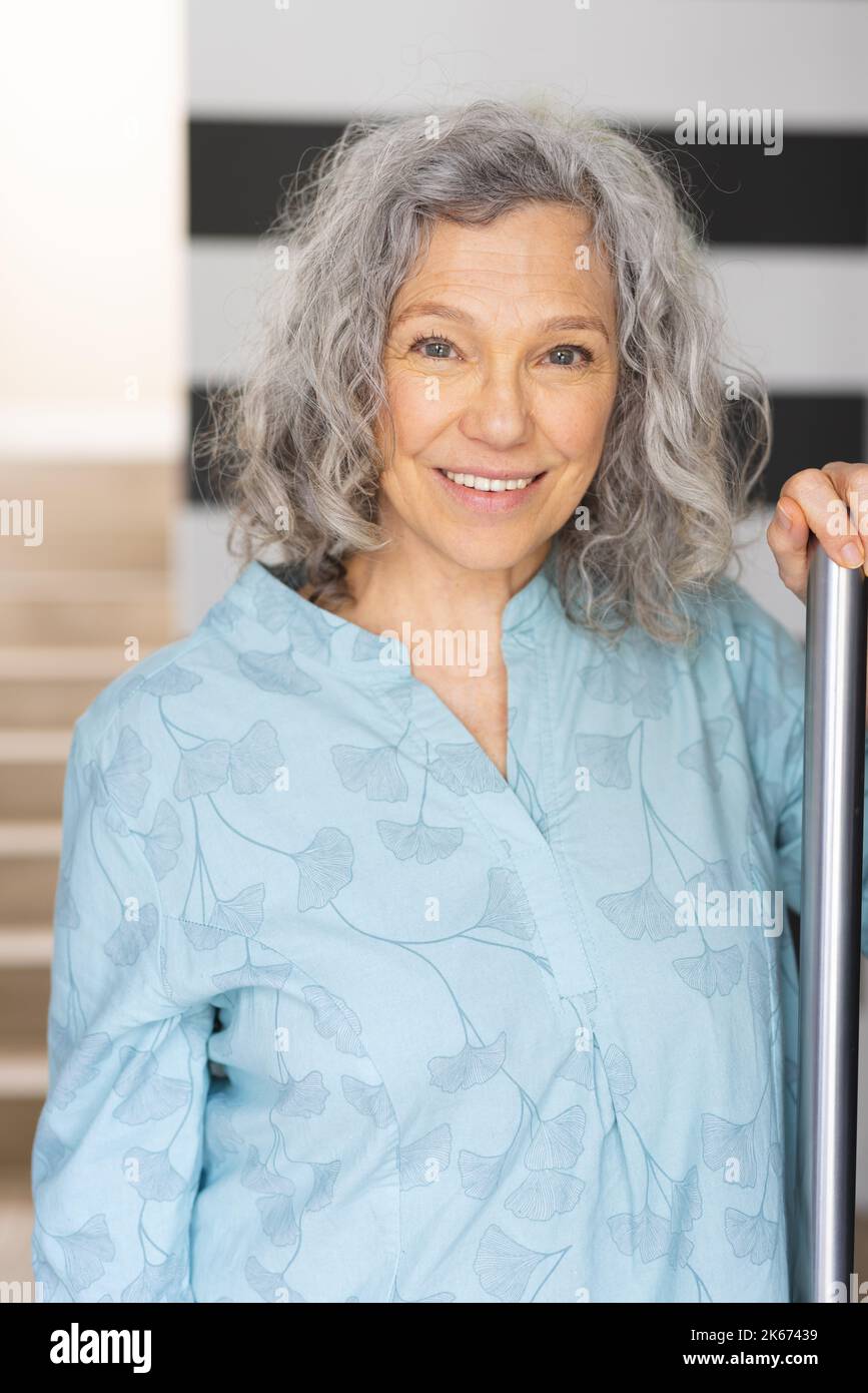Vertical Picture Of Happy African Senior Caucasian Women Opening Door