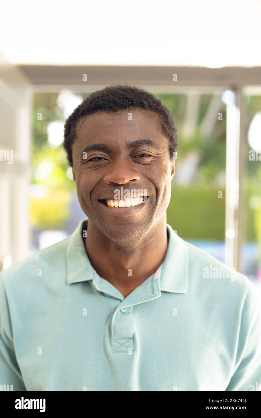 Vertical picture of happy african american men welcoming somebody ...