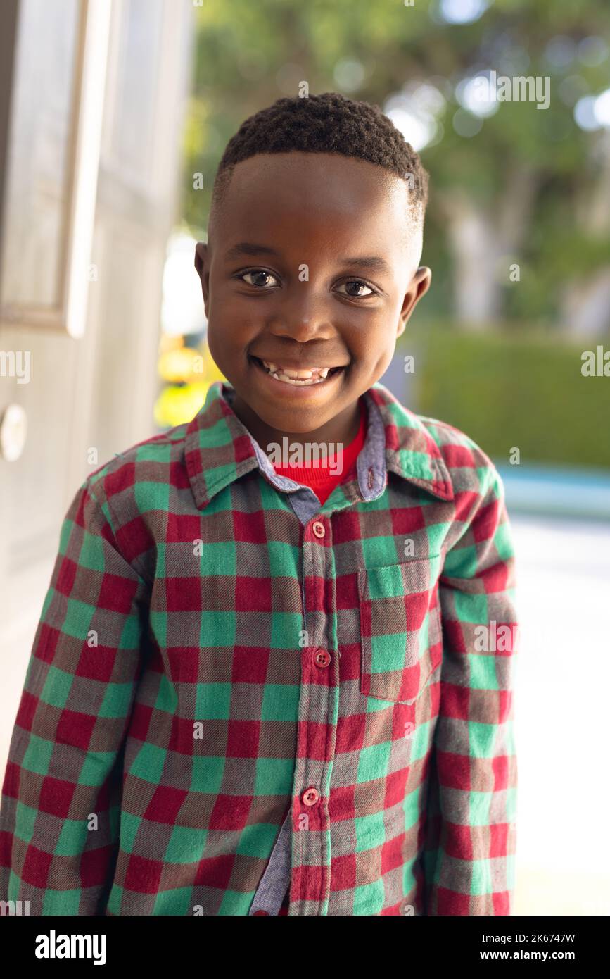 Vertical picture of happy african american boy welcoming somebody ...