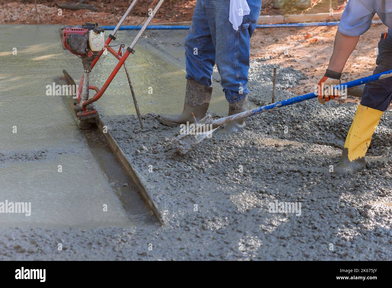 In construction new driveway, machine is used to align on compacted ...