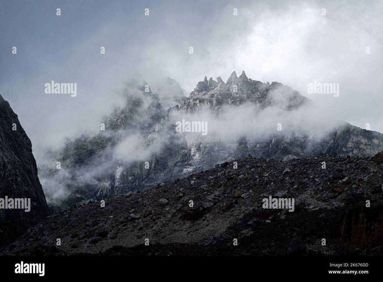 The cloud and mist clears on the peaks high above the Everest Way, trek ...