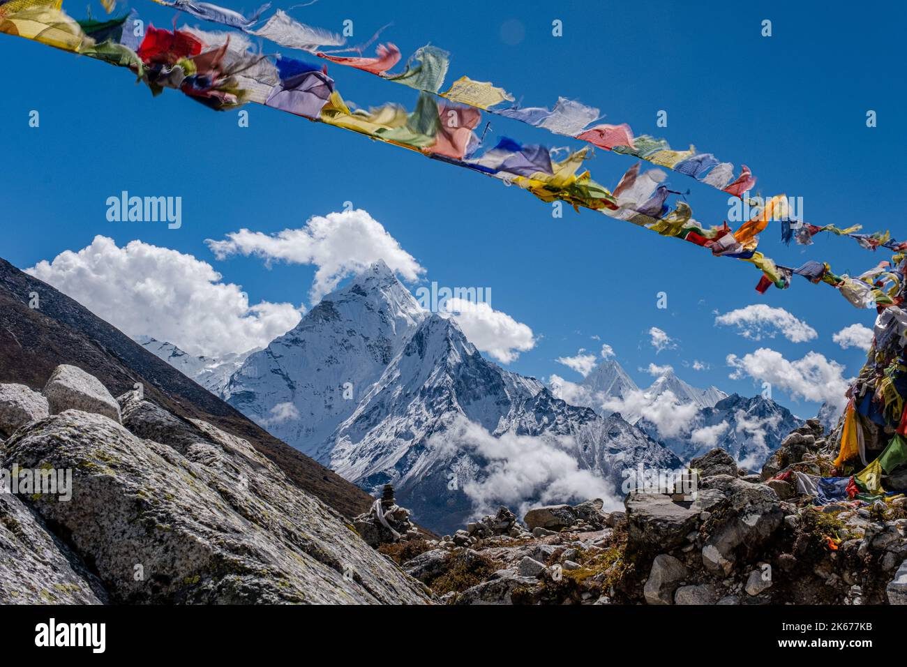 Mt Nuptse from the Everest Memorial with prayer flags Stock Photo - Alamy
