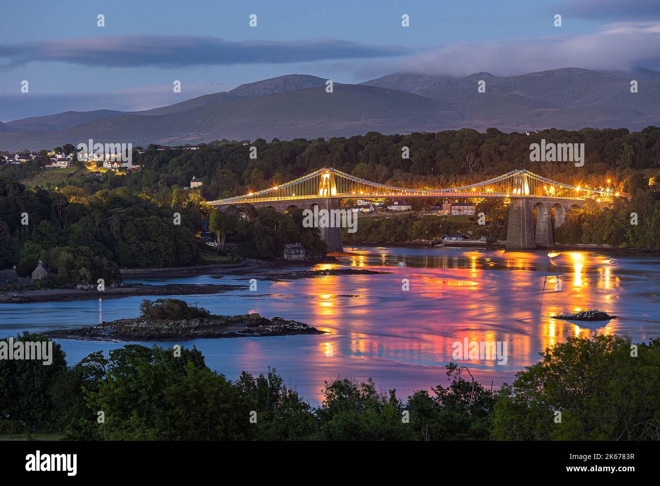 Menai Suspension Bridge with View on Snowdonia mountains, Anglesey ...
