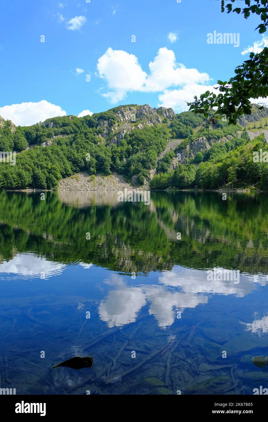 Lake Santo, Lago Santo across the mountains and woods. Nature reflects ...
