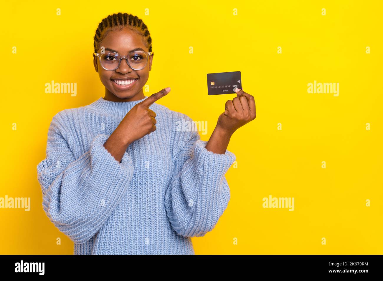 Photo of young lady wear eye glasses holding showing credit card will ...